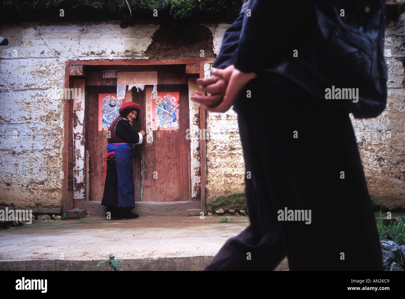 Tibetan lady entering her home Zhongdian County Yunnan Province Peoples ...