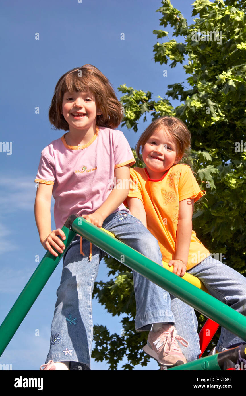 Children playing at a climbing pole Stock Photo - Alamy