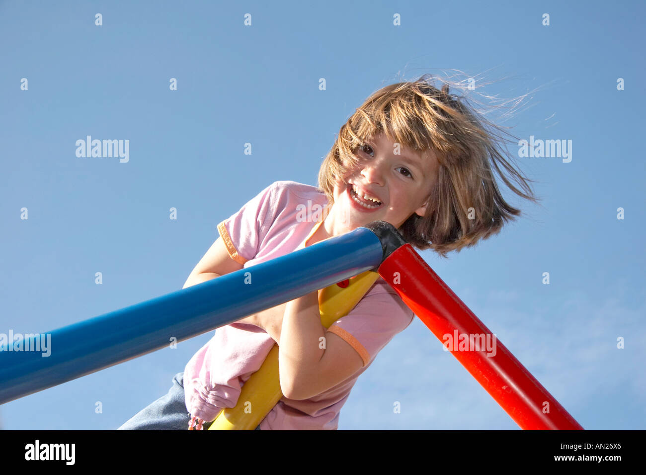 Child playing at a climbing pole Stock Photo - Alamy