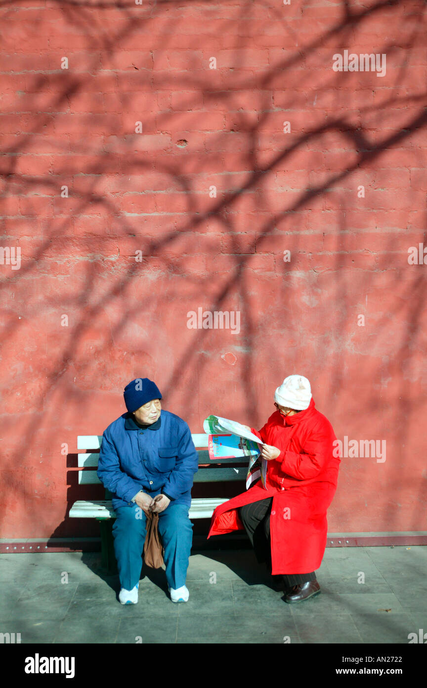 Chinese couple sitting outside the Forbidden City Beijing, Peoples ...