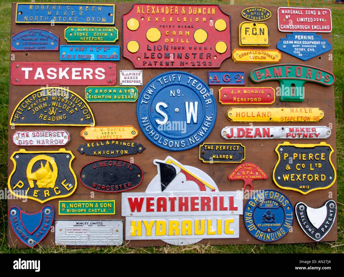 Collection of old colourful nameplates off agricultural machinery at ...