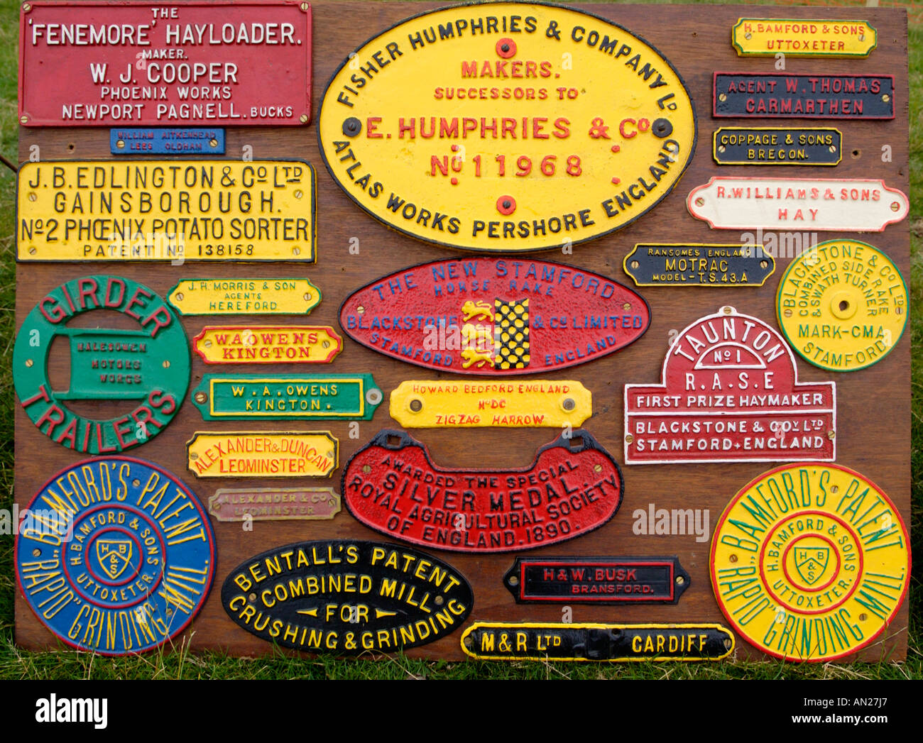 Collection of old colourful nameplates off agricultural machinery at ...