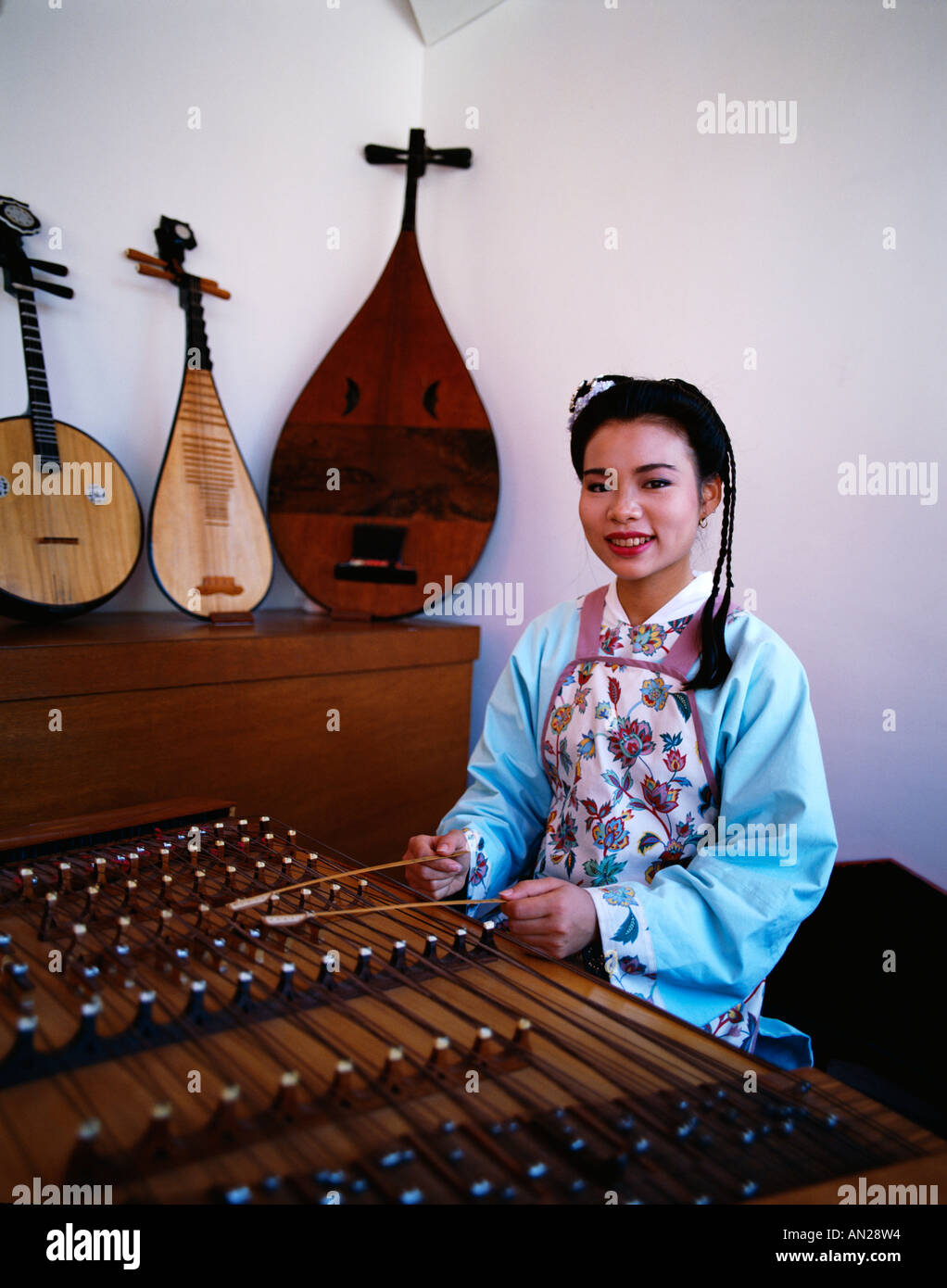 Women Dressed in Traditional Costume Playing Zither, Beijing, China ...