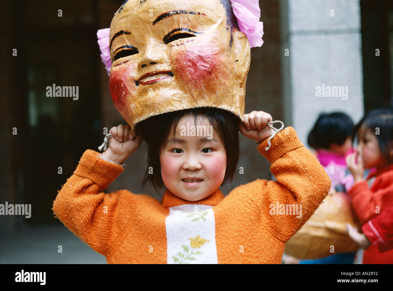 Young Girl / Child with Chinese Lucky God Mask, Beijing, China Stock ...