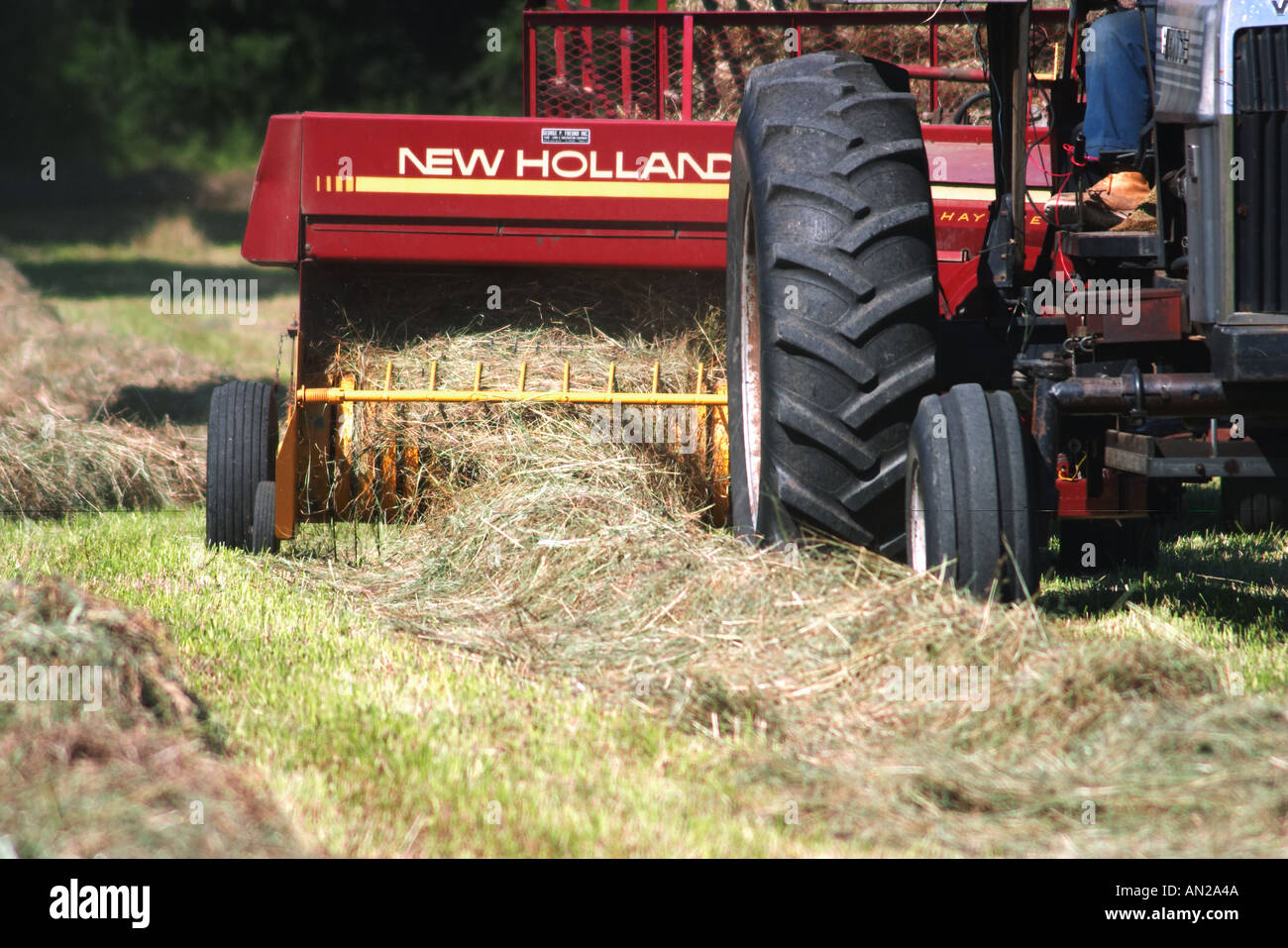 FARMING Lincolnshire Illinois Baling hay in field baling machine pulled ...