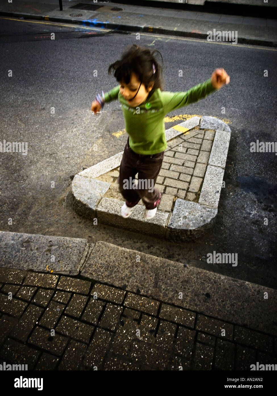 young girl hopping on the street Stock Photo - Alamy