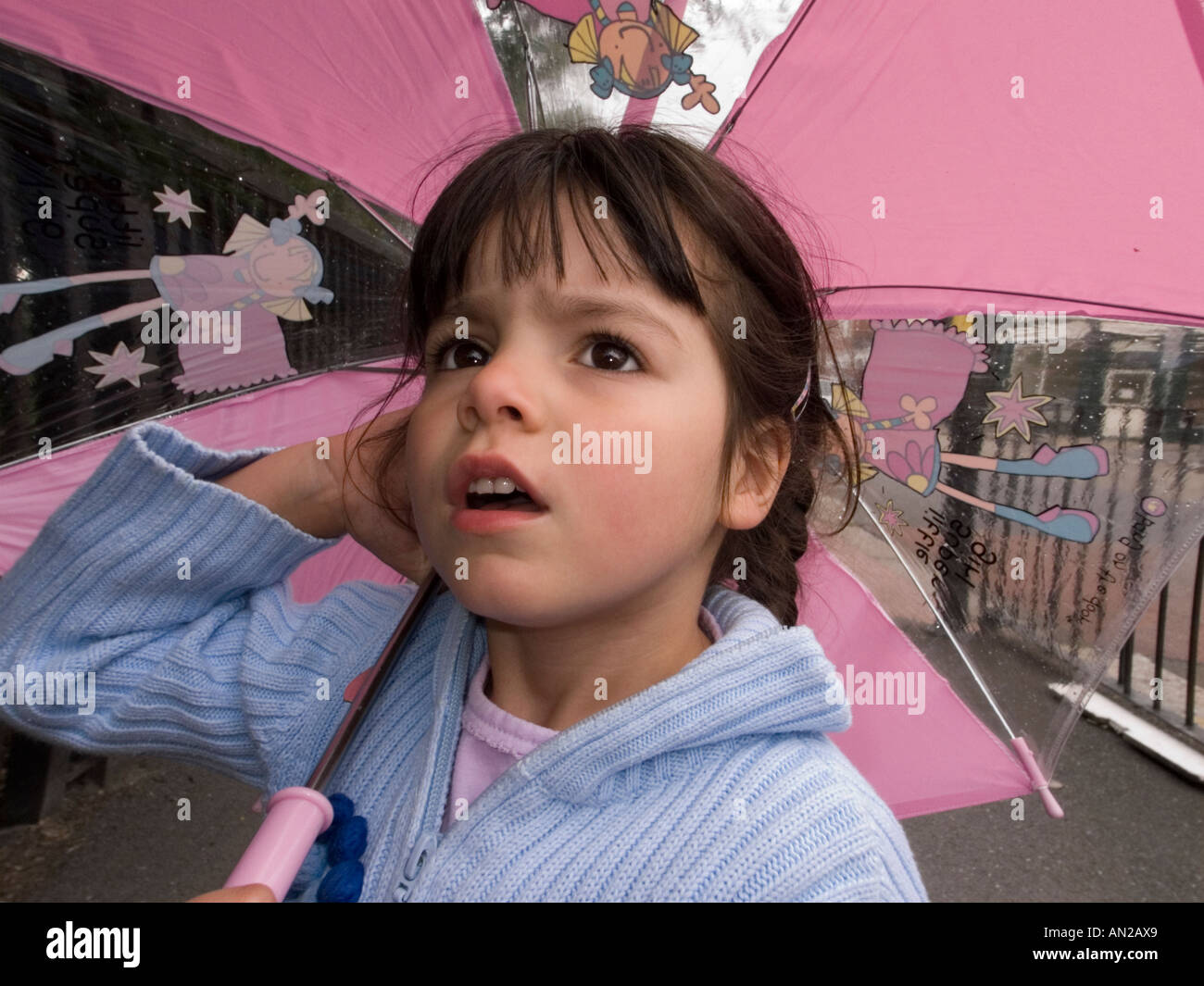 young child holding an umbrella Stock Photo - Alamy