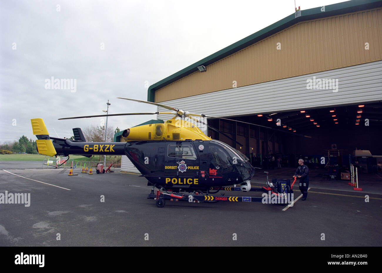 A Police Air Support Unit Helicopter is pushed out from its hanger ...