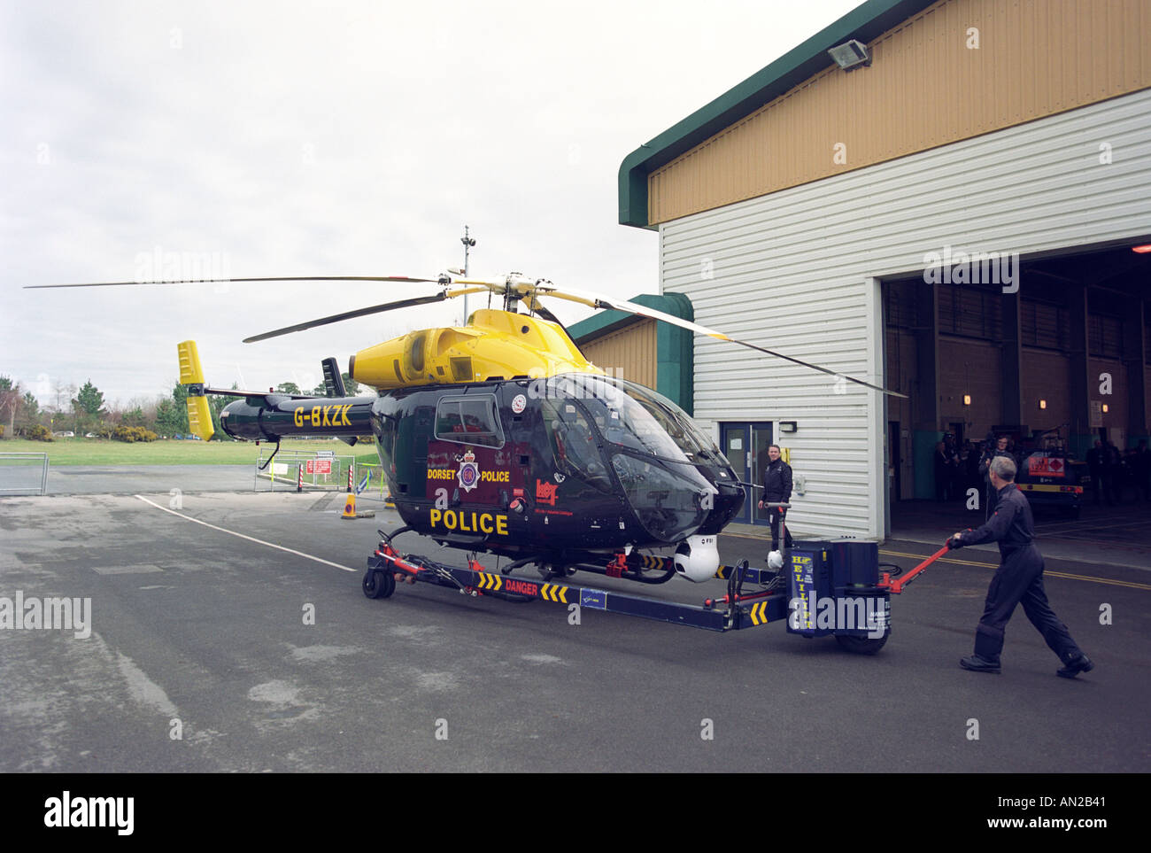 A Police Air Support Unit Helicopter is pushed out from its hanger ...
