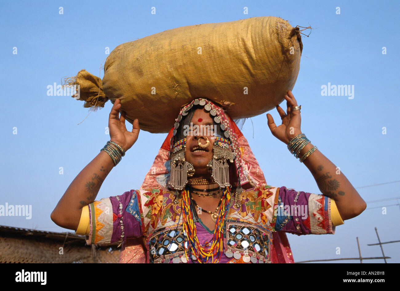 Woman carrying sack on head hi-res stock photography and images - Alamy