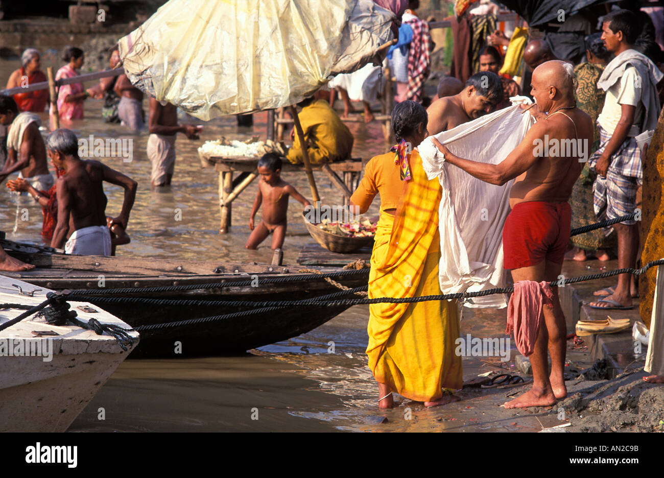 Bathing in the holy water of the Ganges river at Varanasi The ghats are ...