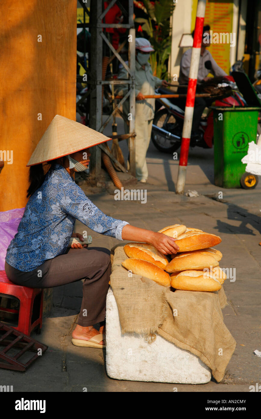 Bread seller in Hanoi Old Quarter Stock Photo - Alamy