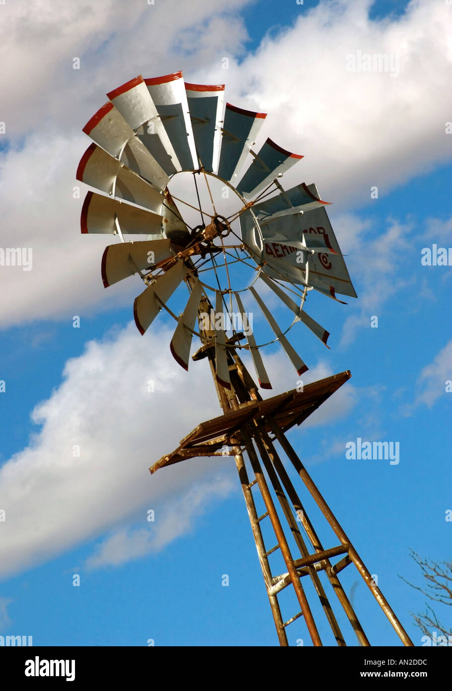 Traditional windmill against a clear sky in rural USA, symbolizing ...