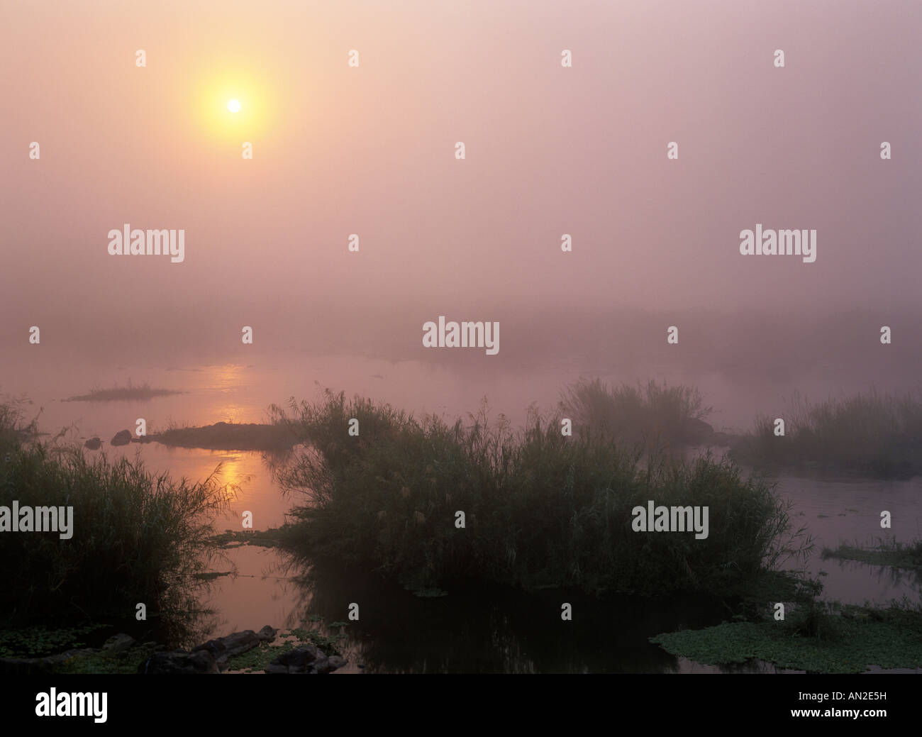 sunrise over Sabie river with morning mist and reflection Lower Sabie ...