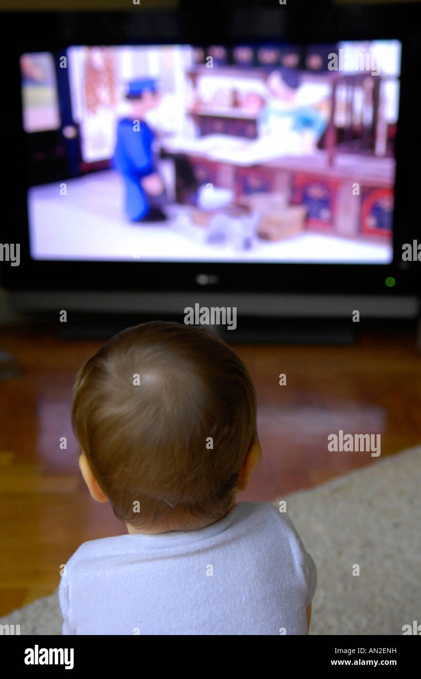 baby watching plasma television tv postman past childrens telly Stock ...