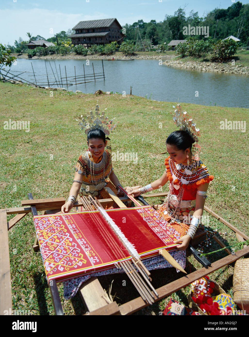 Iban Women Dressed in Traditional Costume doing Traditional Weaving ...