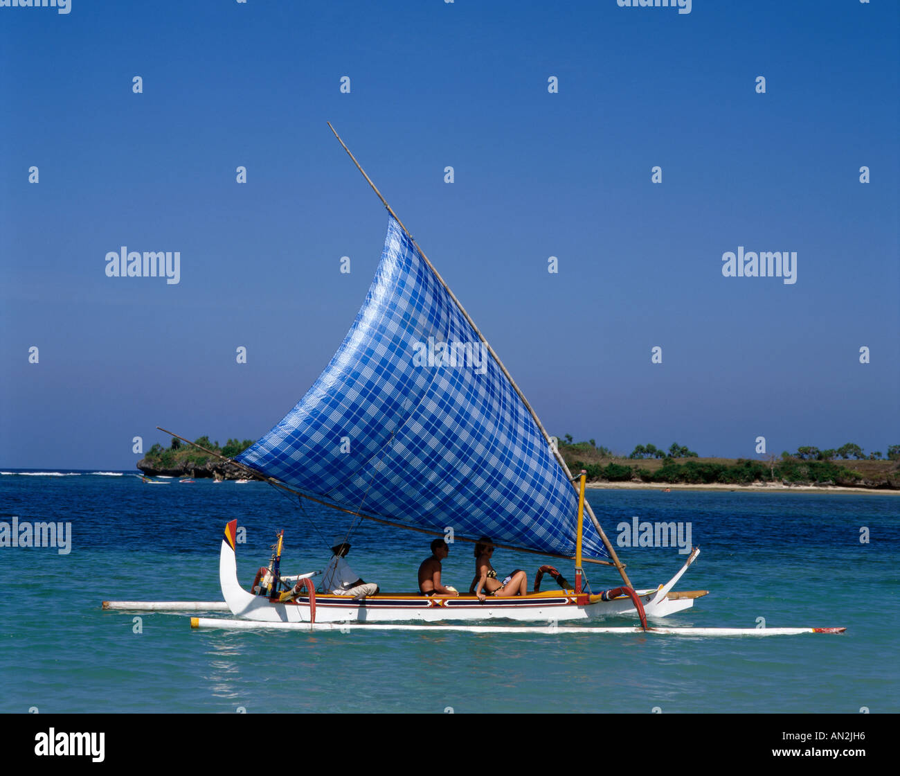 Man and woman on outrigger boat hi-res stock photography and images - Alamy