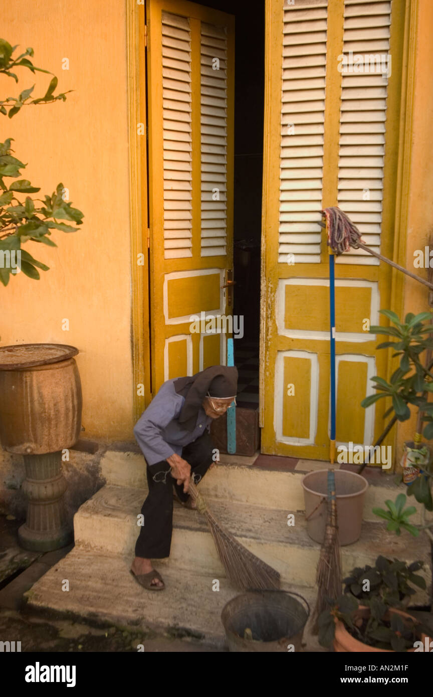 Old Woman cleaning Ho Chi Minh City Vietnam Stock Photo - Alamy