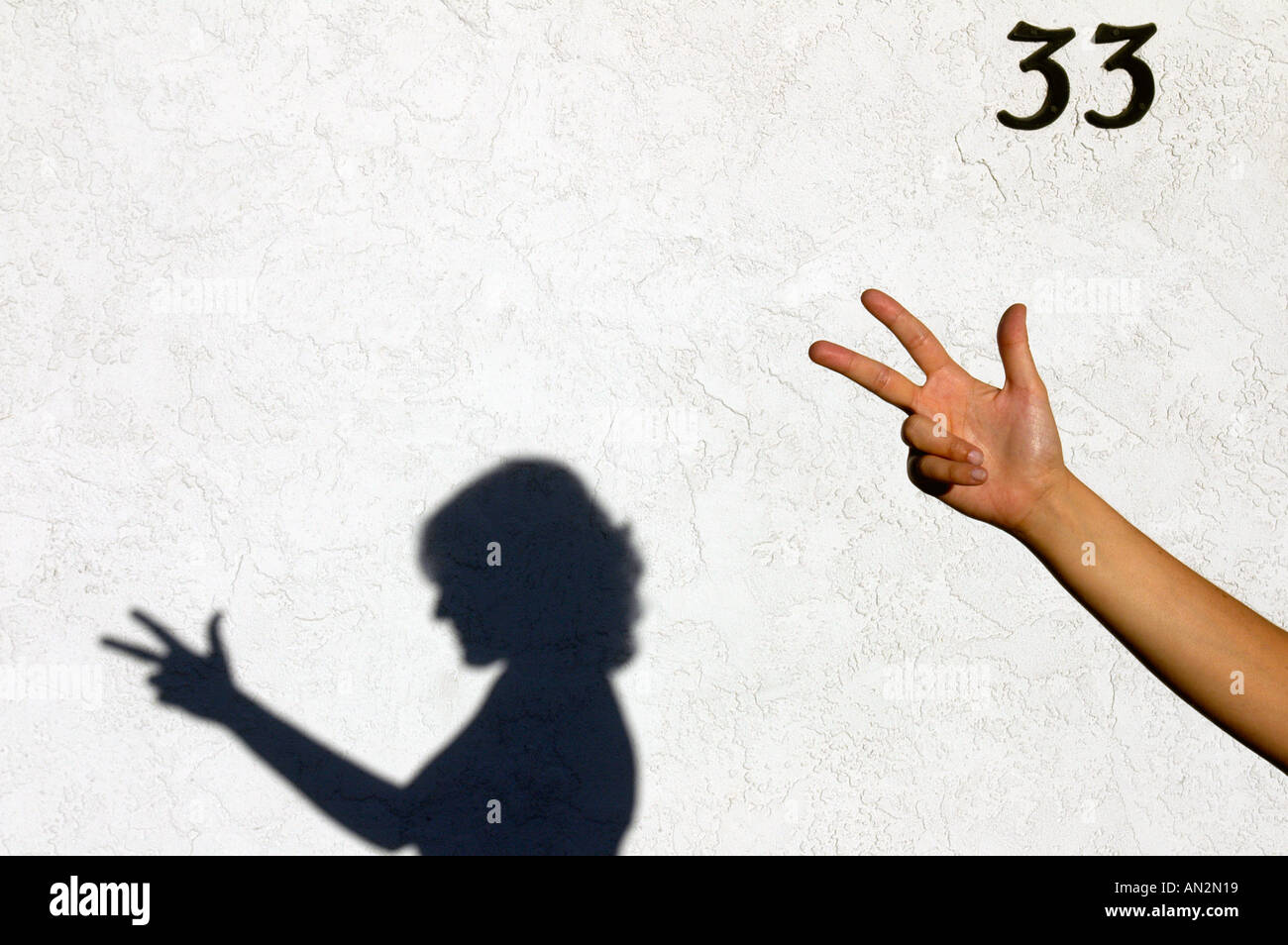 A woman casting the number 3 Stock Photo - Alamy