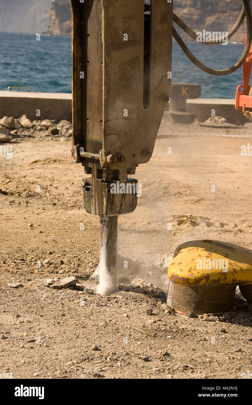 drill in motion digging hole on a pier Stock Photo - Alamy
