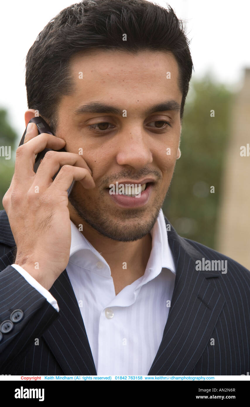 Tre Azam outside underground station speaking on mobile telephone Stock ...