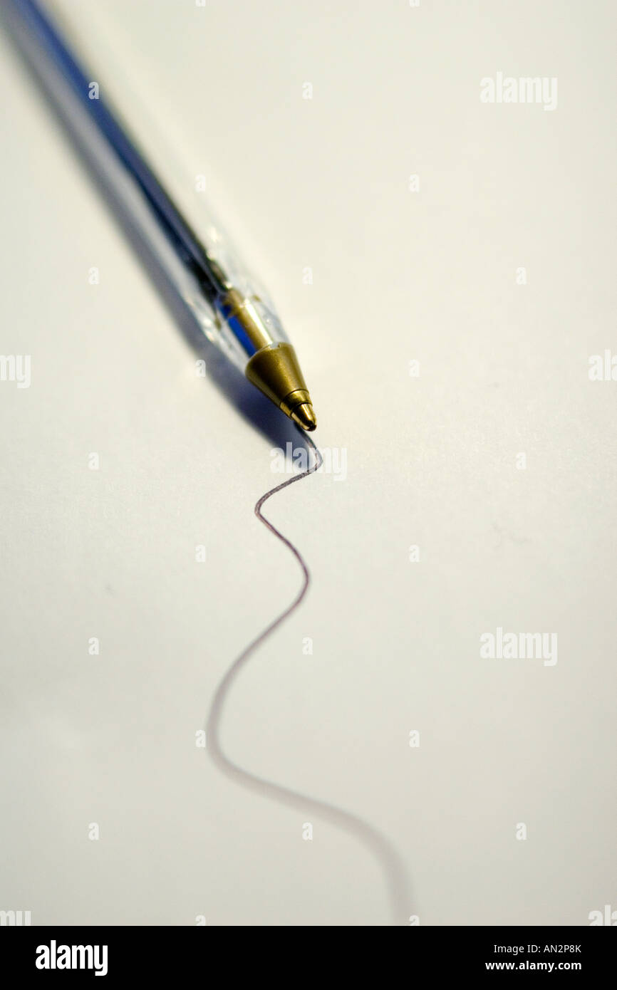 A ballpoint pen drawing a line on a piece of paper Stock Photo - Alamy