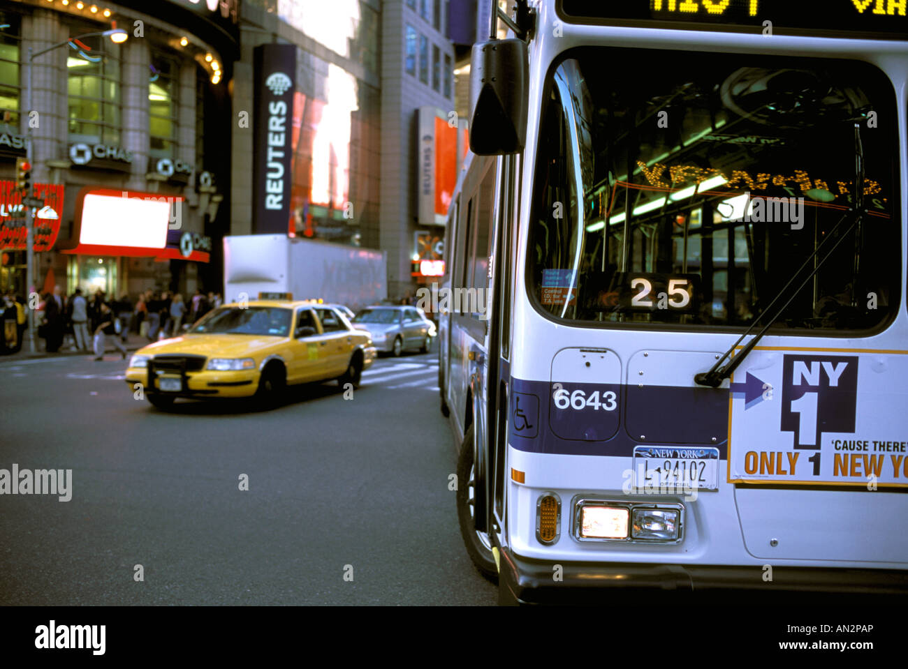 North America, USA, New York, New York City. City bus and taxi in Times ...