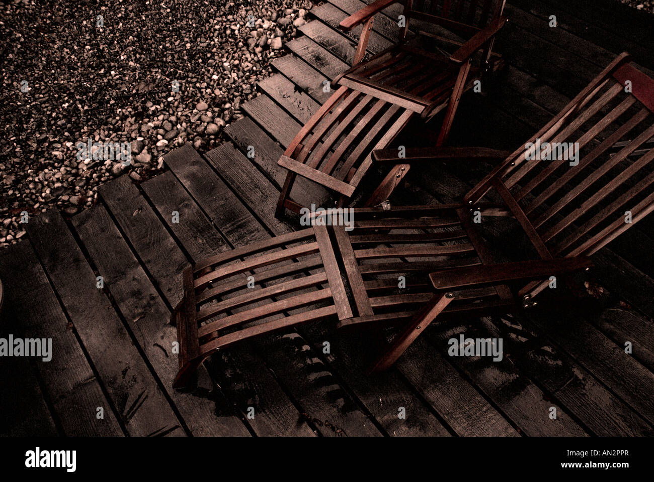 two steamer chairs on boardwalk Stock Photo - Alamy
