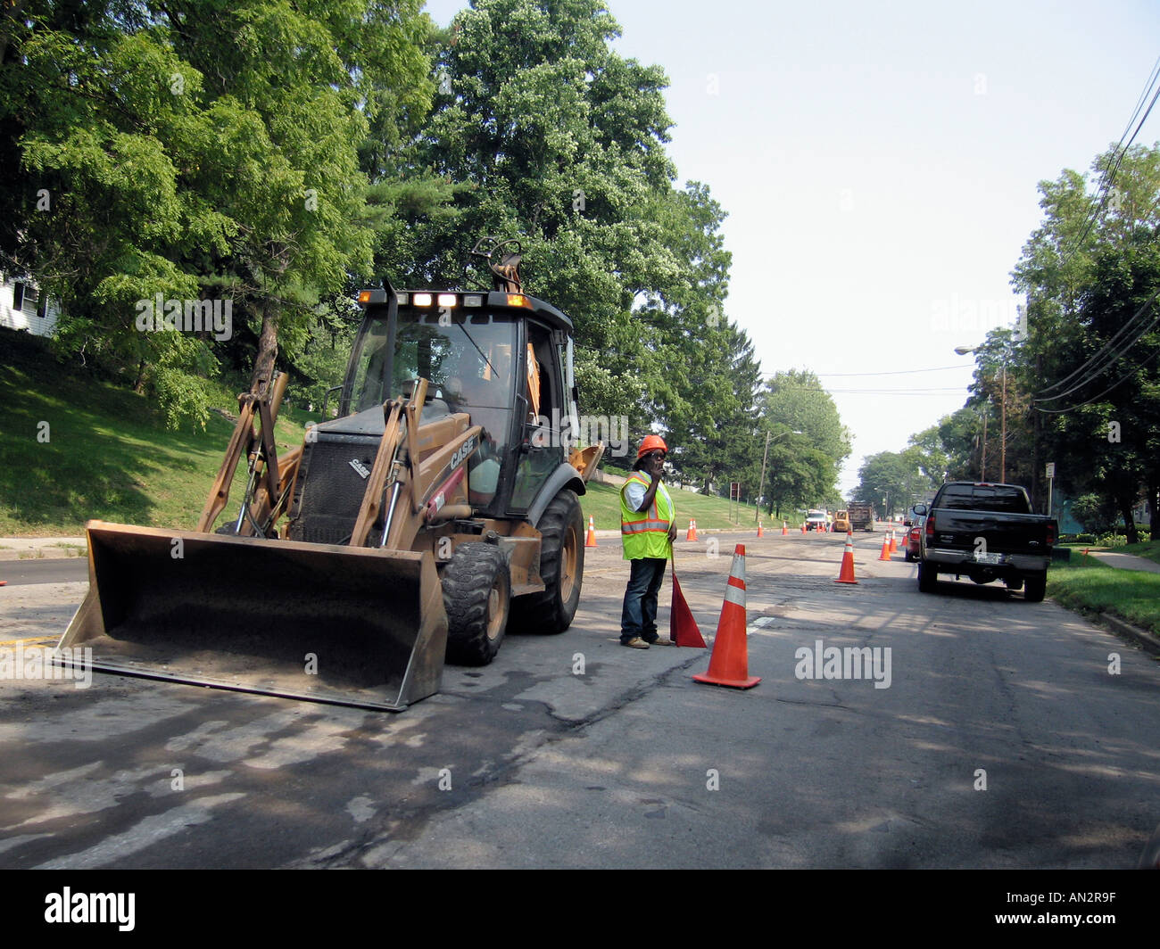 Frontloader repaving road Stock Photo - Alamy