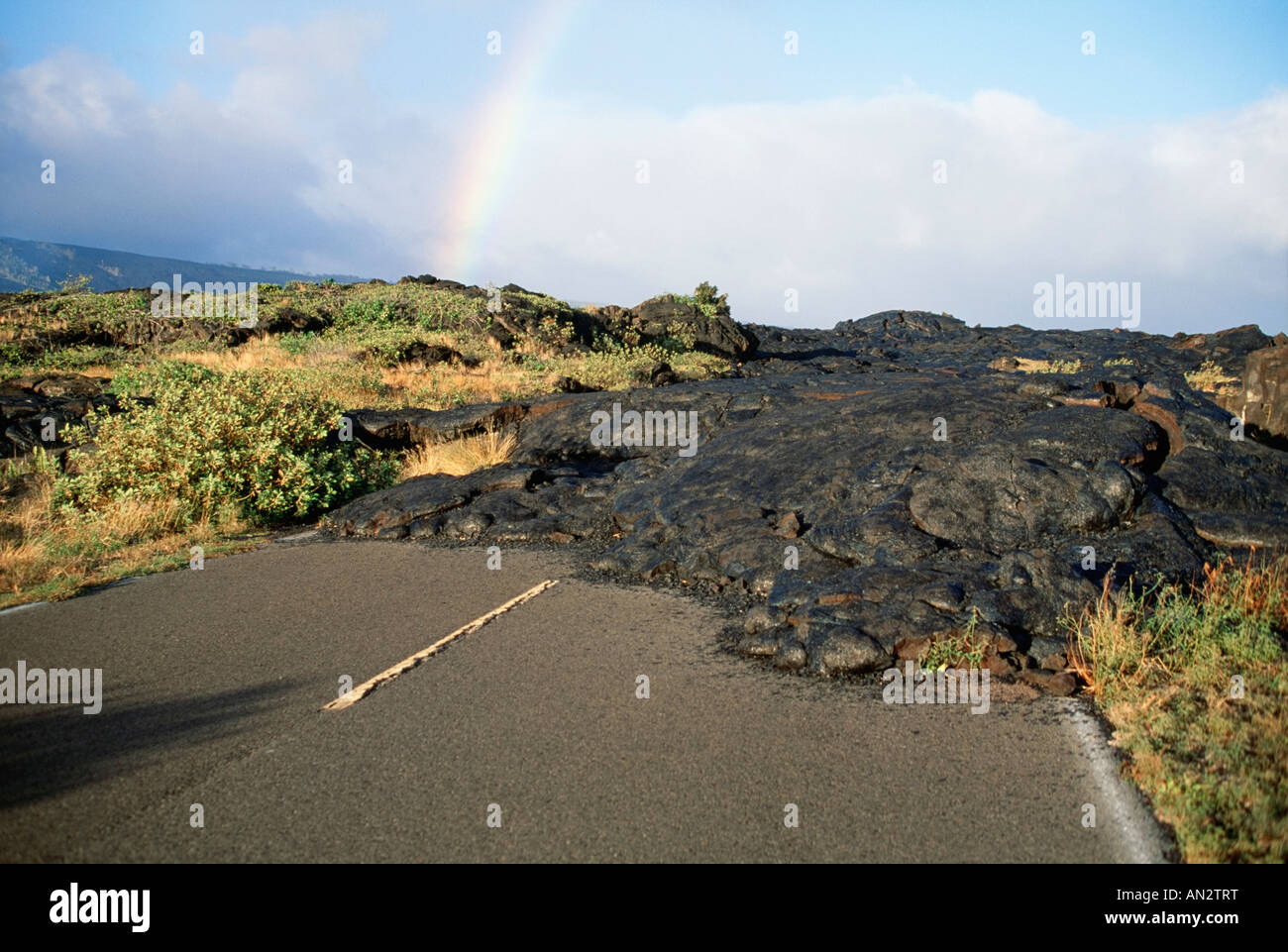 Volcano lava flowing over road National Park, Big Island, Hawaii Stock ...