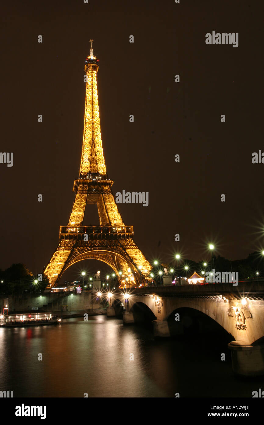 Eiffel Tower and illuminated bridge at night, Paris, France Stock Photo ...