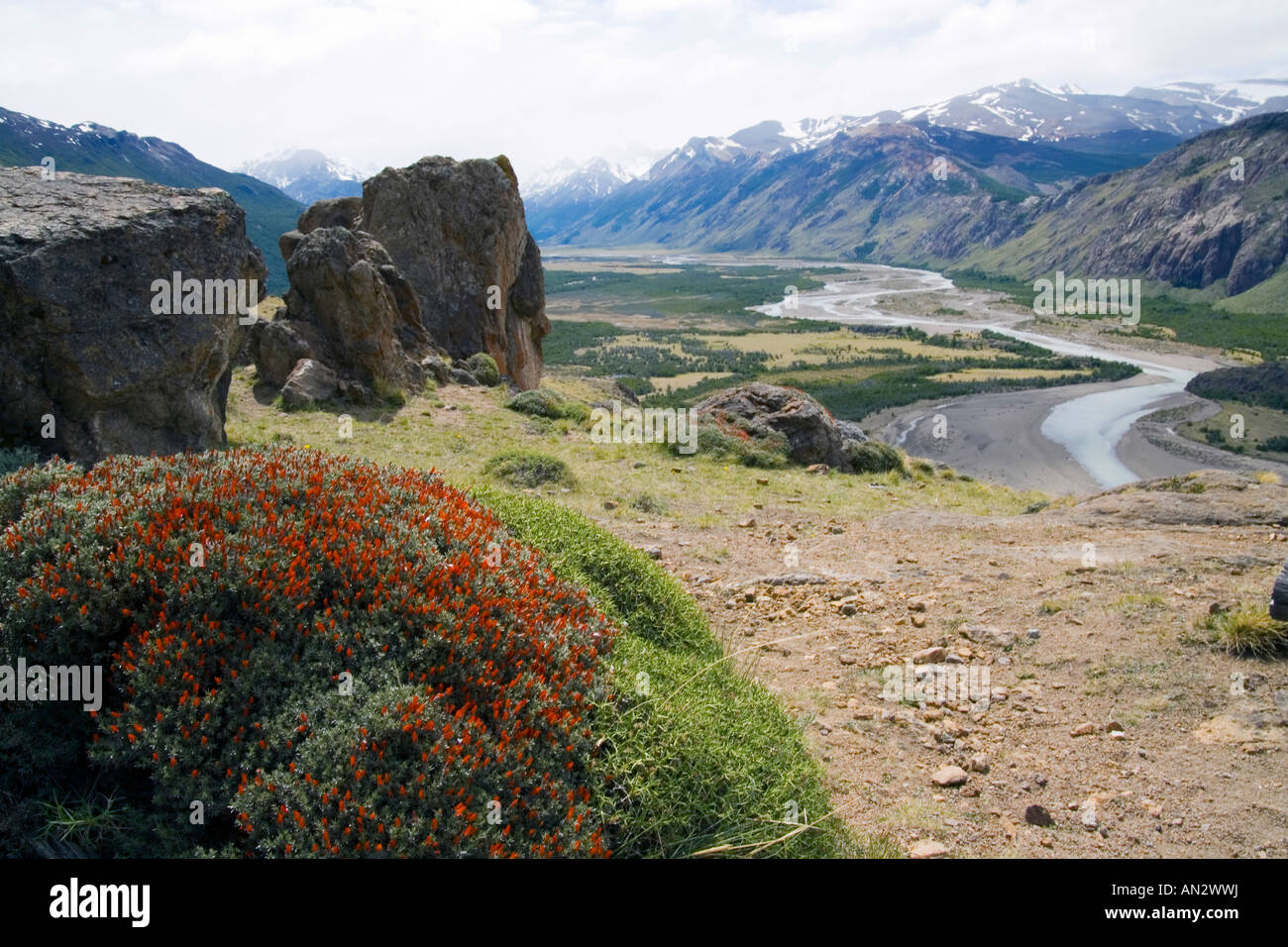 View from above of a valley with a river meandering along the valley ...