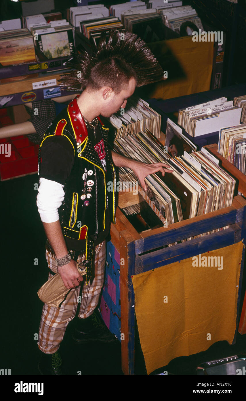 Young Punk Teen in Record Store with Shopping Stock Photo - Alamy