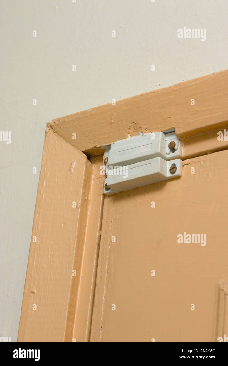 home intrusion alarm sensor fixed at door Stock Photo - Alamy
