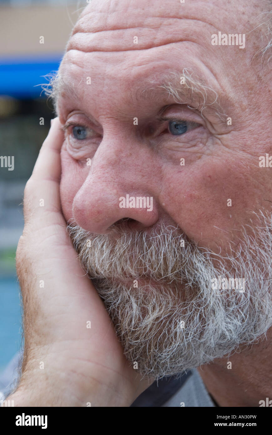 Bearded blue eyed older man with quizzical expression Stock Photo - Alamy