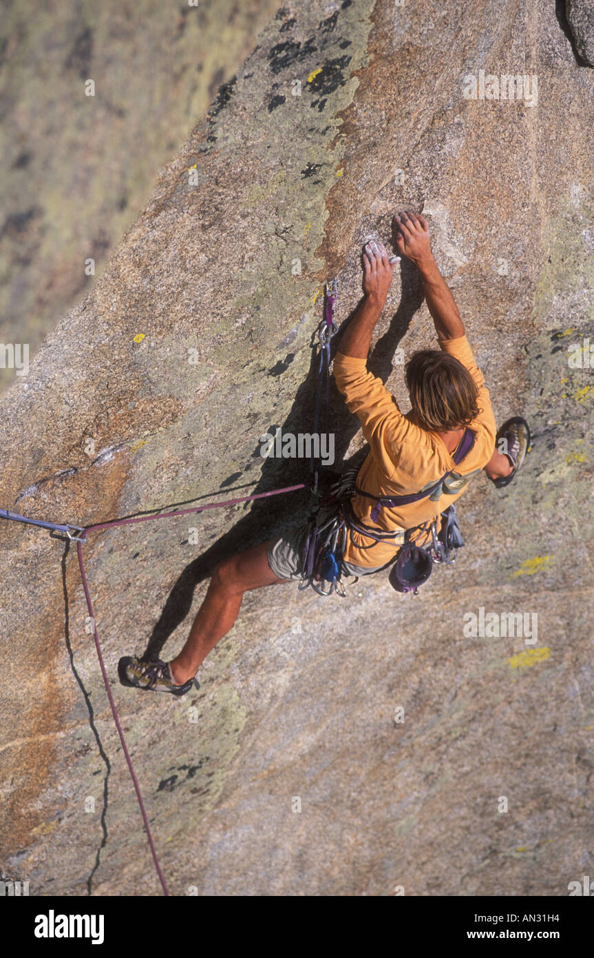 Rock climber hanging onto handholds Stock Photo - Alamy