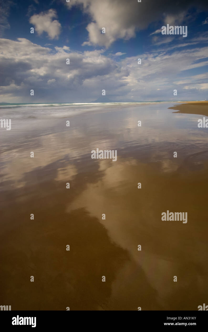 Reflection on wet sand Stock Photo - Alamy