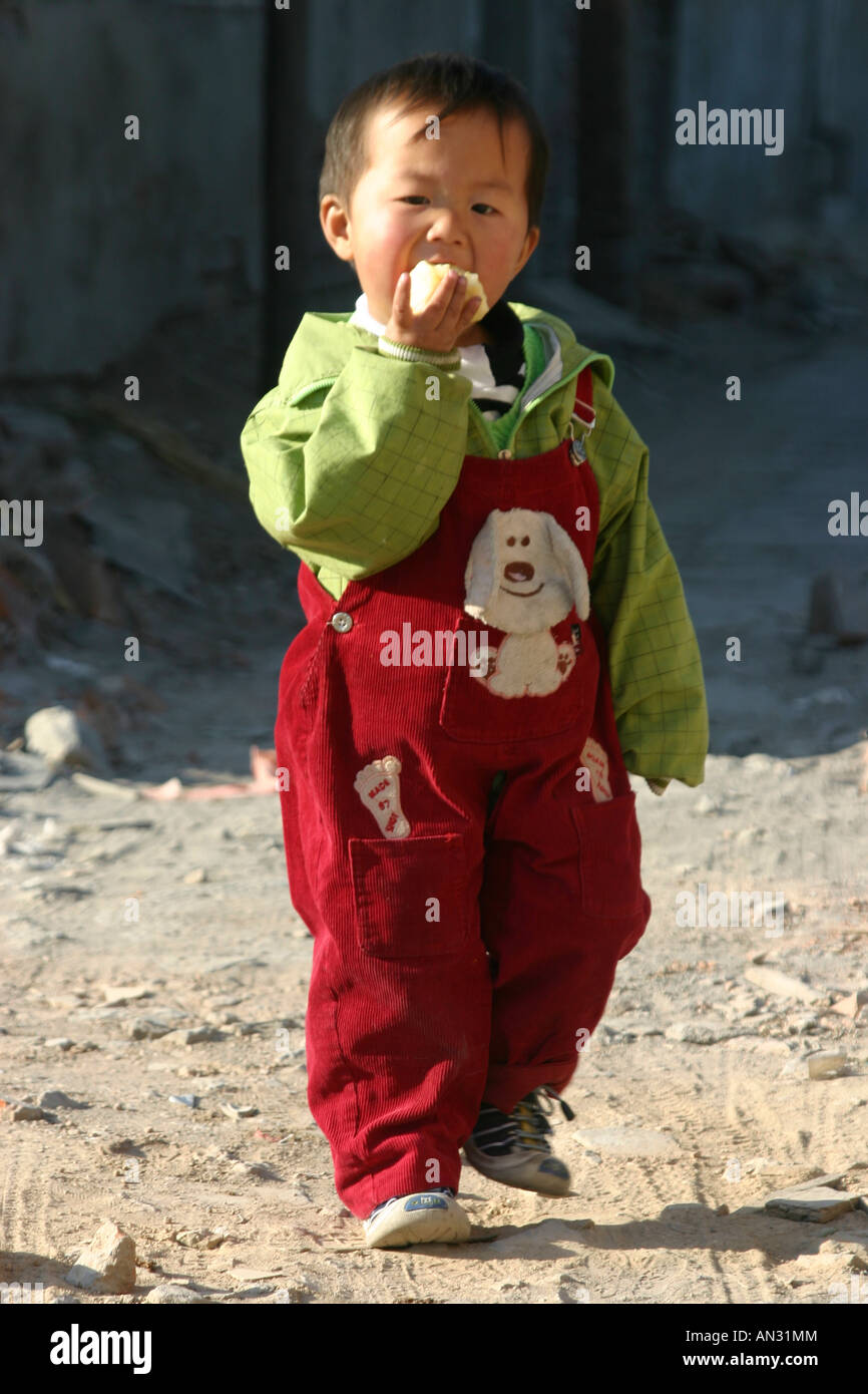 Chinese boy eating fruit hi-res stock photography and images - Alamy