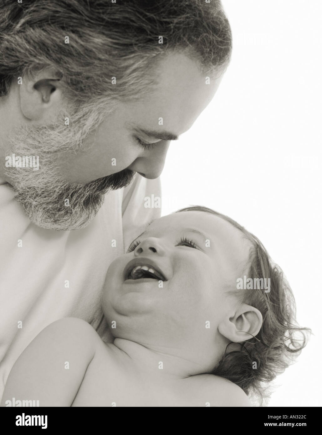 Black and white image of father nurturing baby son Stock Photo - Alamy