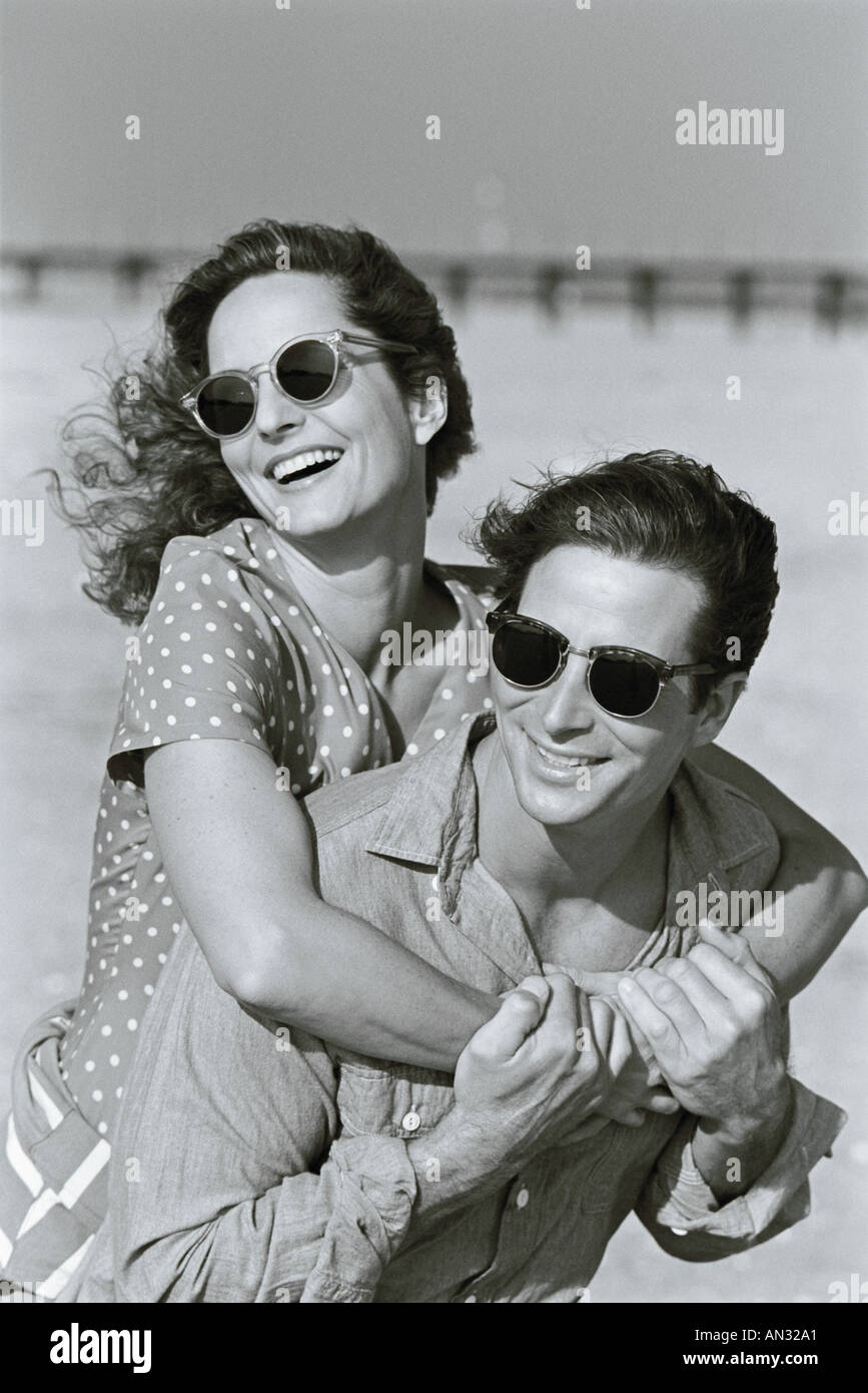 Black and white image of couple romping on New Jersey beach Stock Photo ...