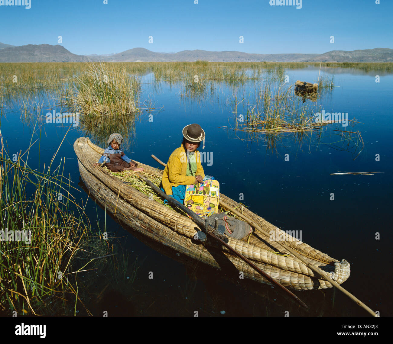 Lake Titicaca / Uros Indian Woman & Child Sitting in Traditional Reed ...