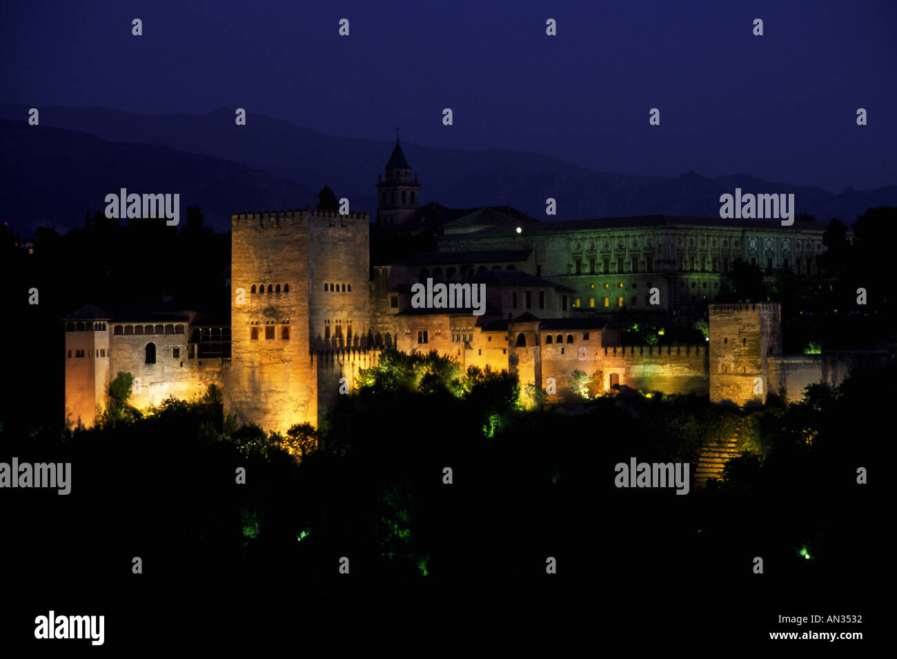 View of the Alhambra Palace at night with moon Stock Photo - Alamy