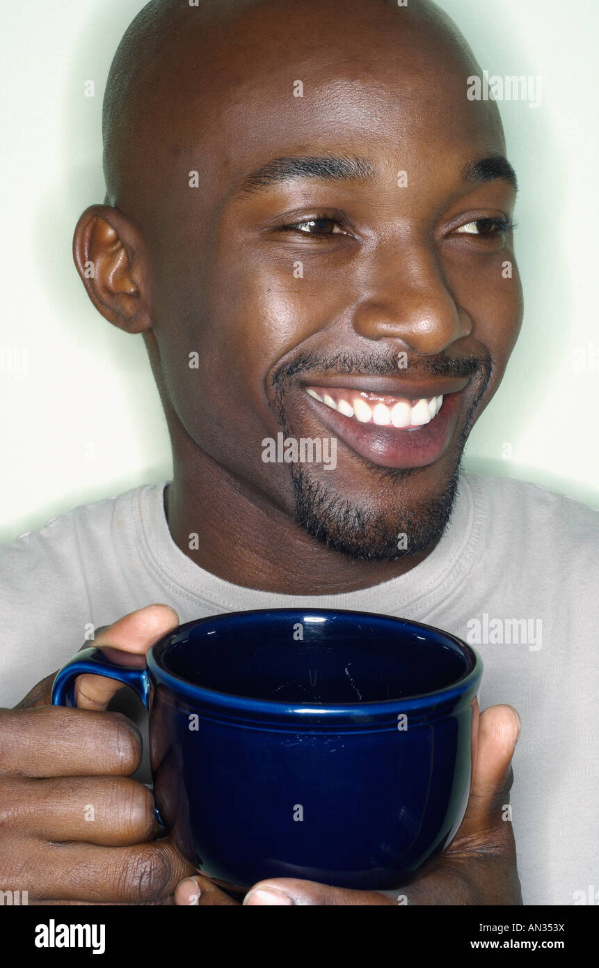 Portrait of African man drinking coffee Stock Photo - Alamy