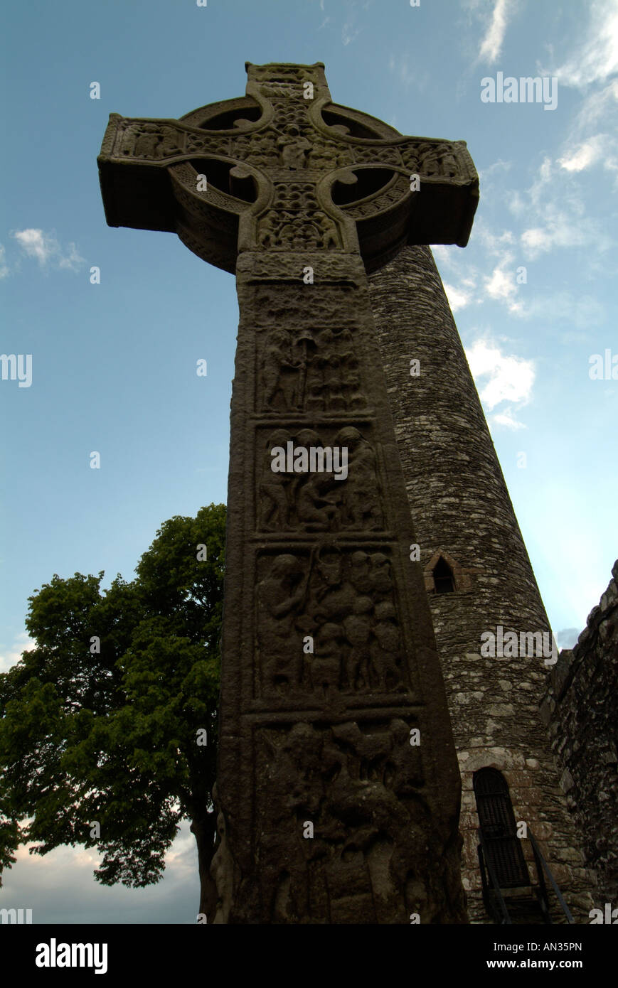 Closeup of the round tower and the Cross of Muiredach a famous 10th ...