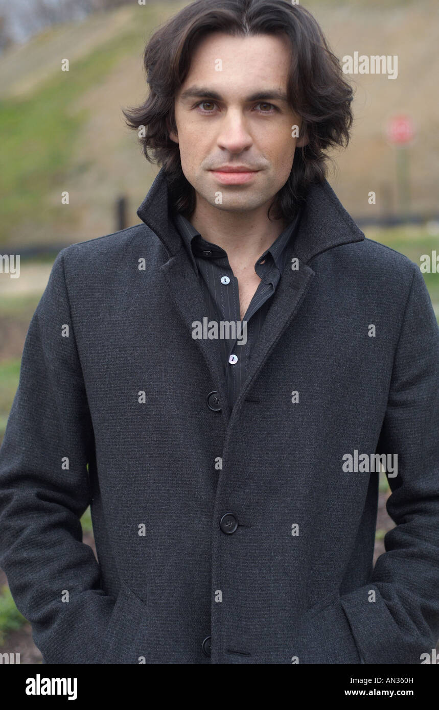 Portrait of man with hands in jacket pockets Stock Photo - Alamy