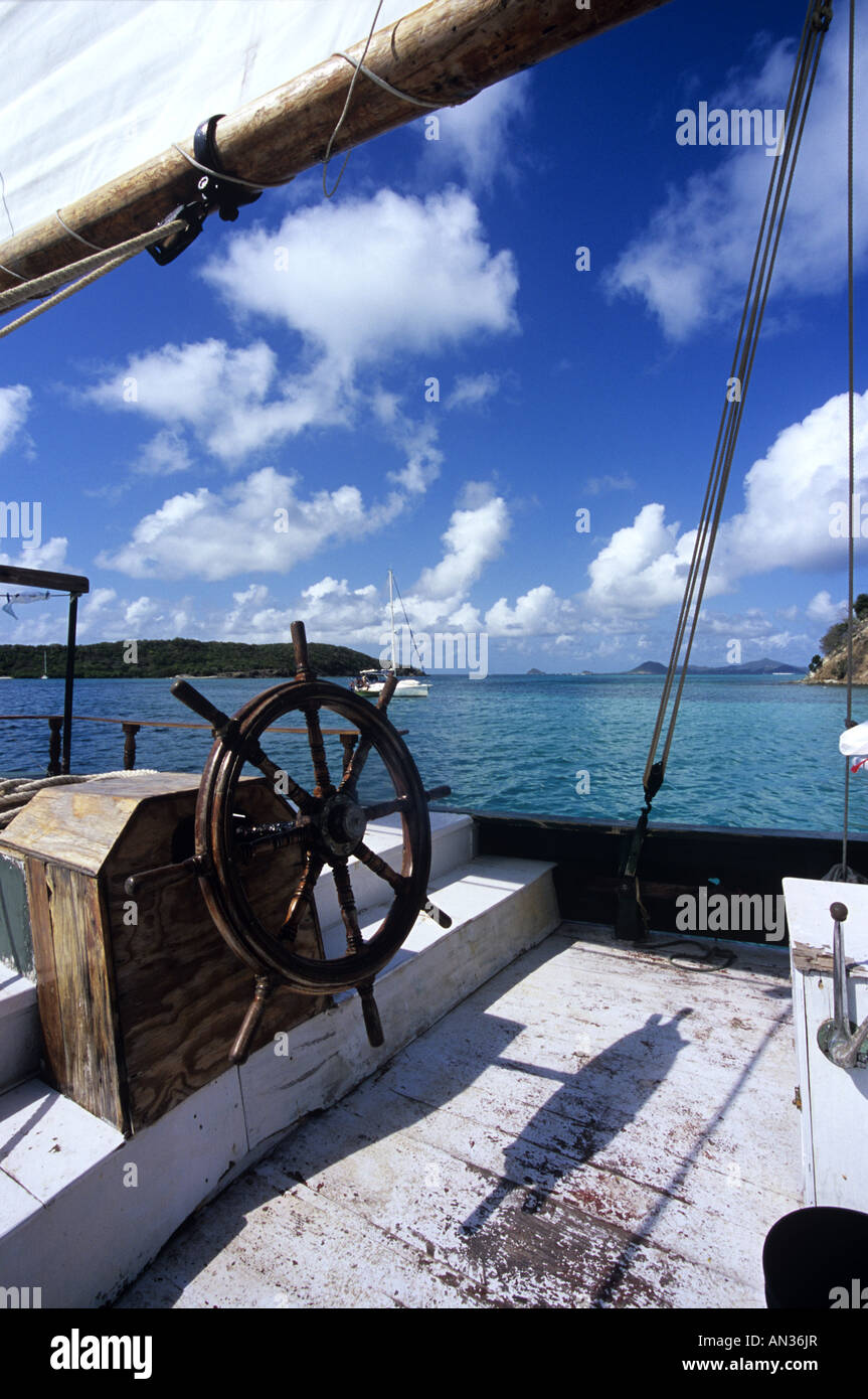 The Wheel of the Schooner Scaramouche and a view of the Grenadines ...