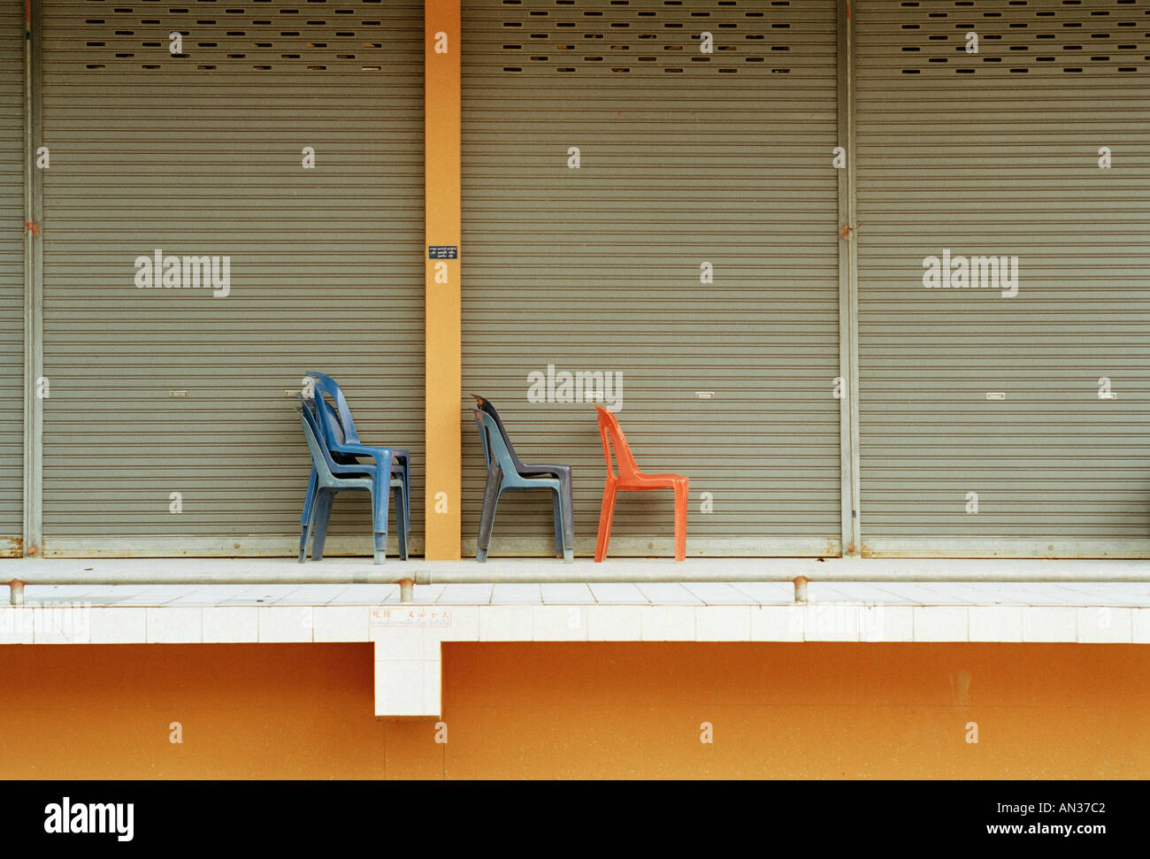 plastic chairs in a row Stock Photo - Alamy