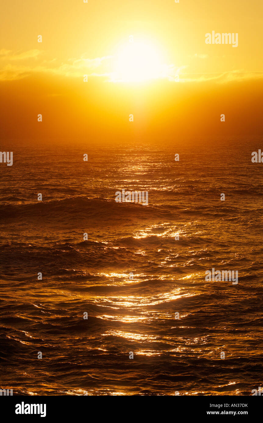 Golden sunset across the open ocean Stock Photo - Alamy