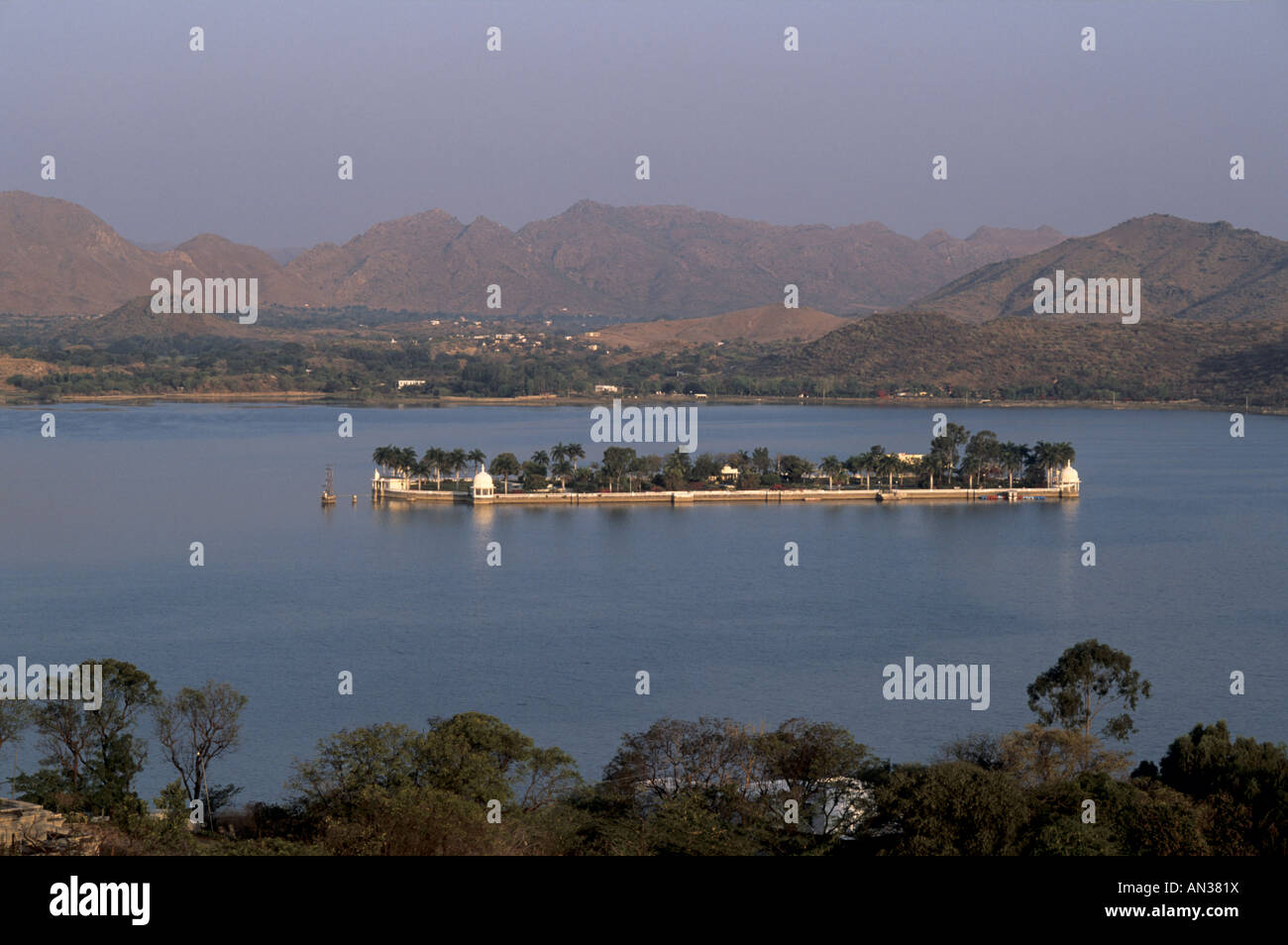 The Fateh Sagar Lake with the island of Nehru Garden at dawn, Udaipur ...