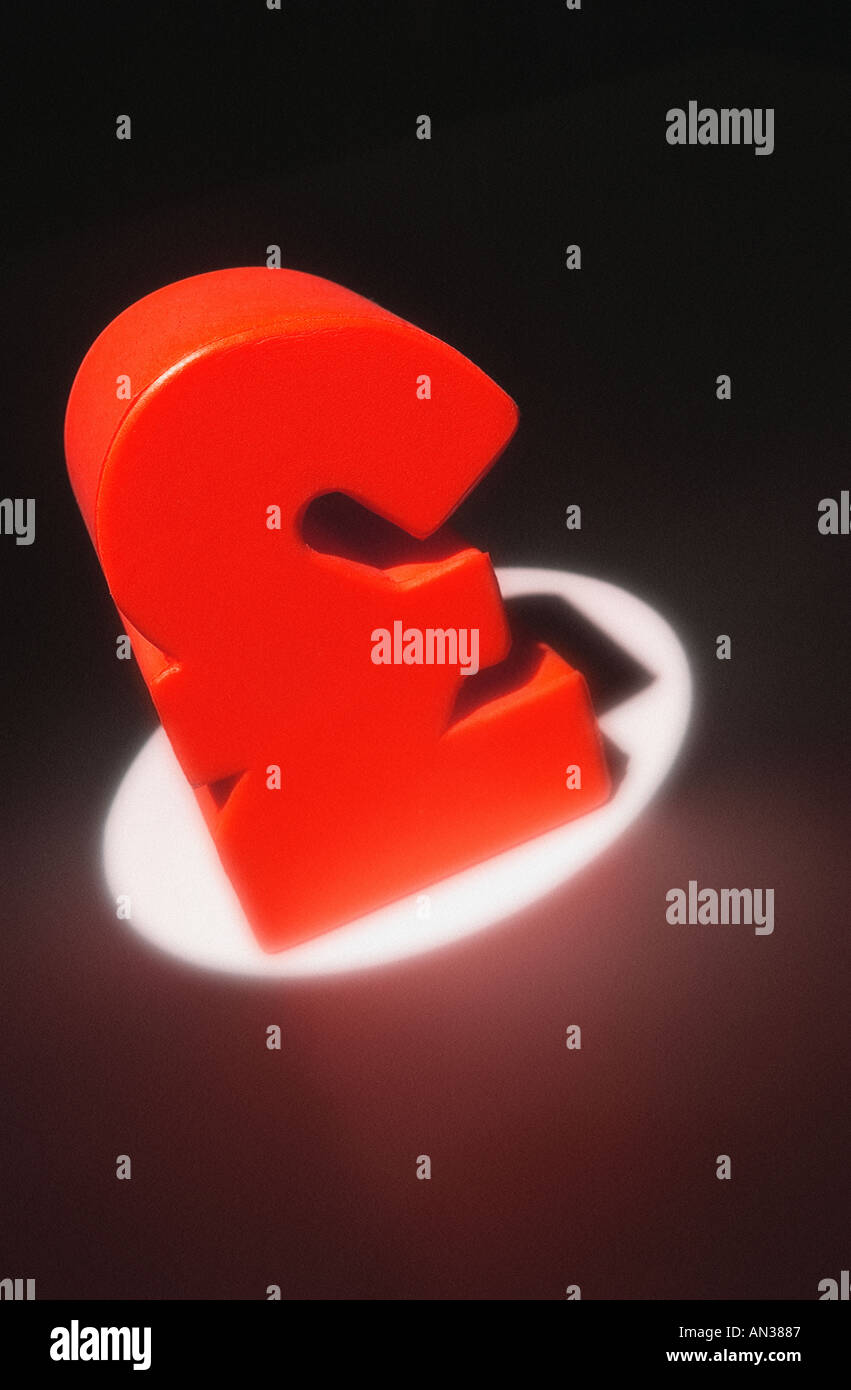 Conceptual image. Red pound sign in spotlight with a black background ...